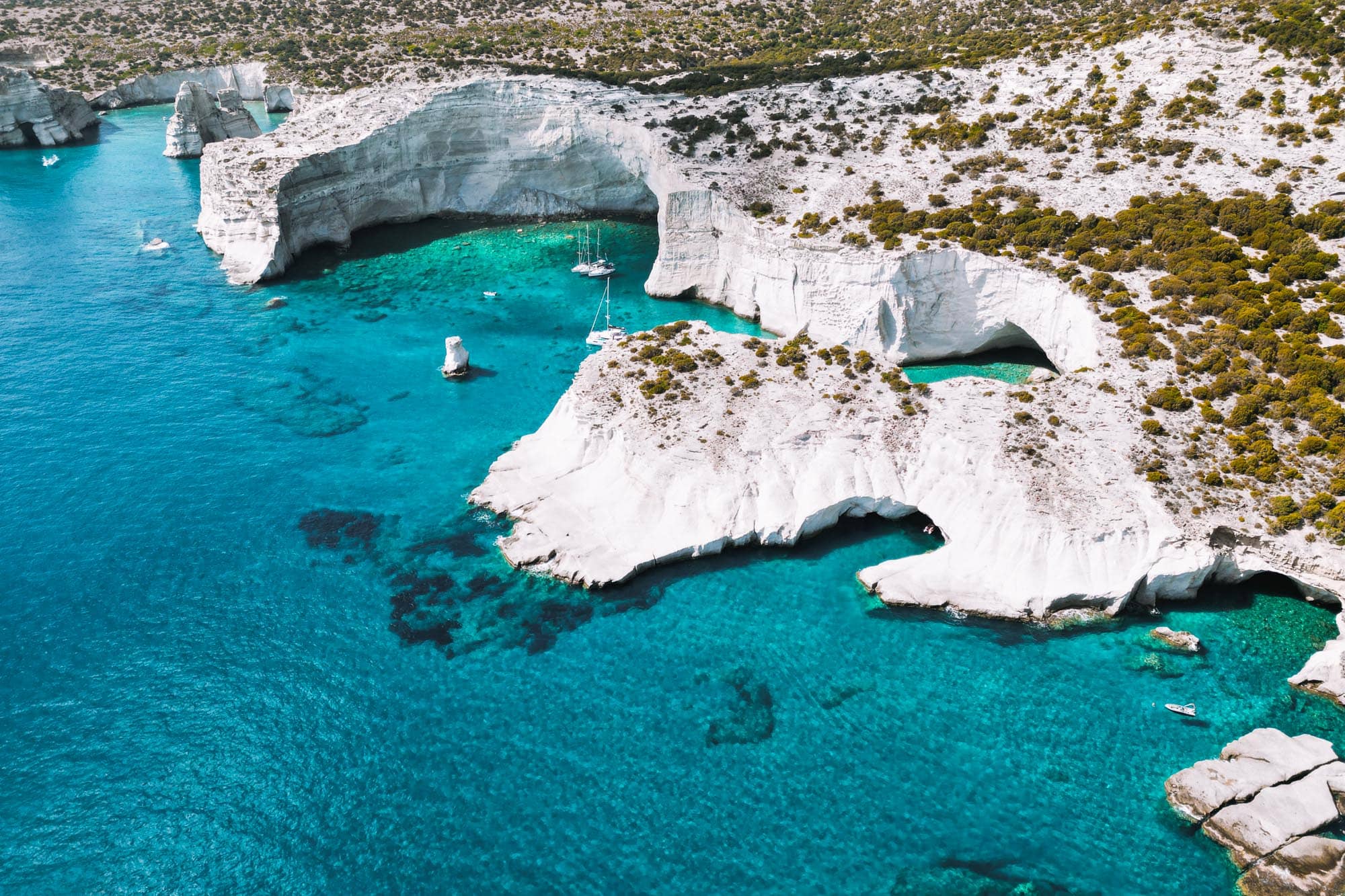 MUST DO: Sailing the Westcoast of Milos in Greece - Travelrebels